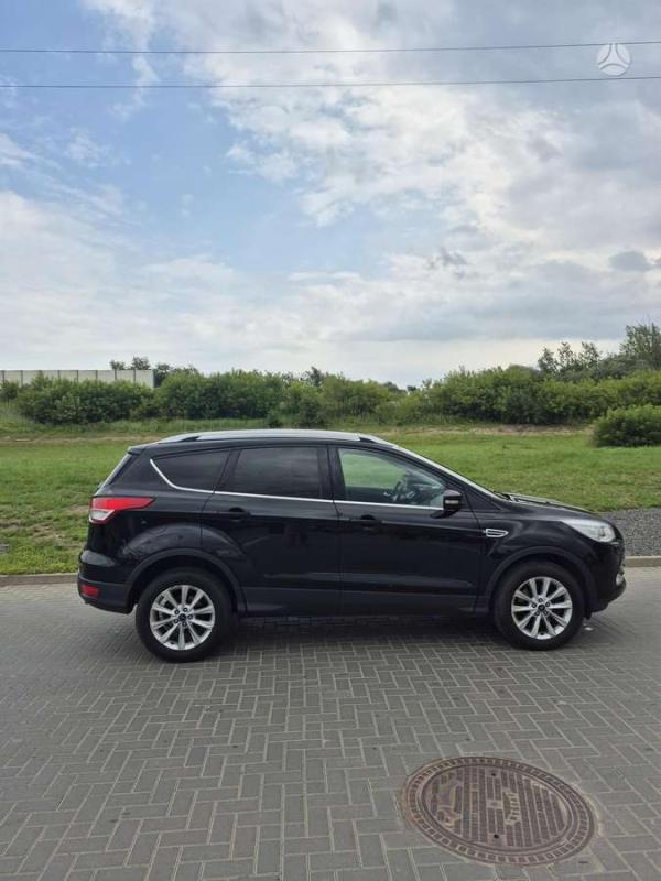 Black Ford Kuga 2017 in Kaunas, with an engine capacity of 2.00 L and mileage of 202 thousand km for 10200 €, photo 1 on AUTOMOTO.COM.LV