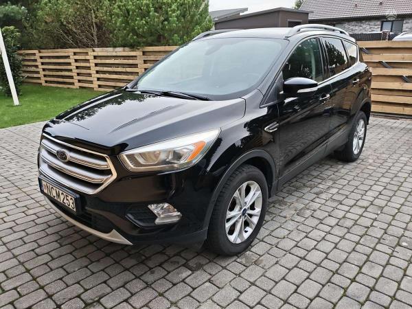 Black Ford Kuga 2017 in Silute, with an engine capacity of 1.50 L and mileage of 220 thousand km for 9400 €, photo 1 on AUTOMOTO.COM.LV