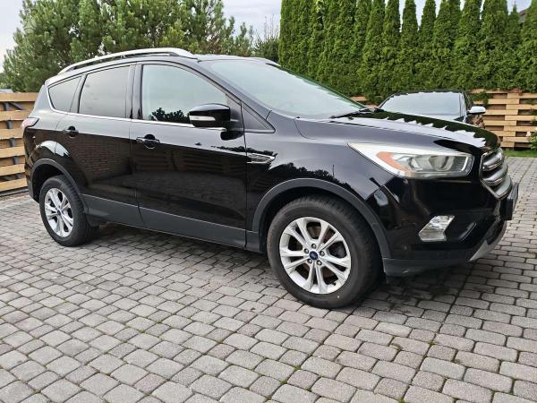 Black Ford Kuga 2017 in Silute, with an engine capacity of 1.50 L and mileage of 220 thousand km for 9400 €, photo 4 on AUTOMOTO.COM.LV