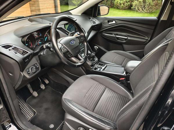 Black Ford Kuga 2017 in Silute, with an engine capacity of 1.50 L and mileage of 220 thousand km for 9400 €, photo 10 on AUTOMOTO.COM.LV