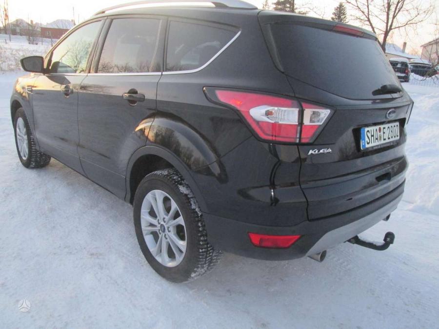 Black Ford Kuga 2018 in Kelme, with an engine capacity of 1.50 L and mileage of 31 thousand km for 14990 €, photo 4 on AUTOMOTO.COM.LV