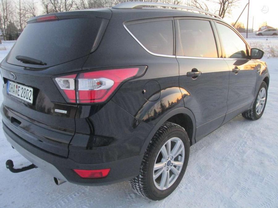 Black Ford Kuga 2018 in Kelme, with an engine capacity of 1.50 L and mileage of 31 thousand km for 14990 €, photo 5 on AUTOMOTO.COM.LV