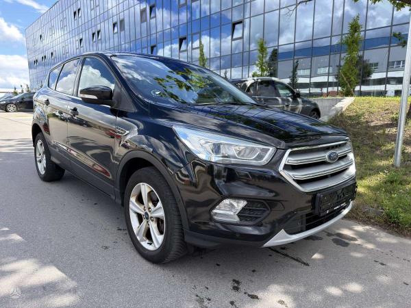 Black Ford Kuga 2018 in Panevezys, with an engine capacity of 2.00 L and mileage of 258 thousand km for 8850 €, photo 1 on AUTOMOTO.COM.LV