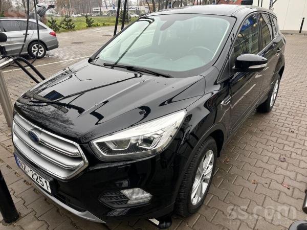 Black Ford Kuga 2018 in Riga, with an engine capacity of 2.00 L and mileage of 141 thousand km for 8750 €, photo 1 on AUTOMOTO.COM.LV