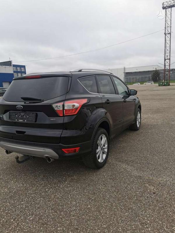 Black Ford Kuga 2019 in Kaunas, with an engine capacity of 1.50 L and mileage of 90 thousand km for 12700 €, photo 3 on AUTOMOTO.COM.LV