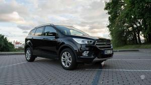 Black Ford Kuga 2019 in Vilnius, with an engine capacity of 1.50 L and mileage of 62 thousand km for 15300 €, photo  on AUTOMOTO.COM.LV
