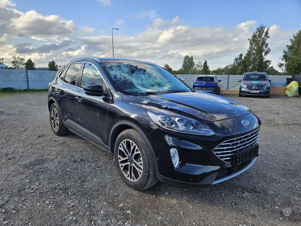 Black Ford Kuga 2020 in Kaunas, with an engine capacity of 2.49 L and mileage of 94 thousand km for 7999 €, photo 1 on AUTOMOTO.COM.LV