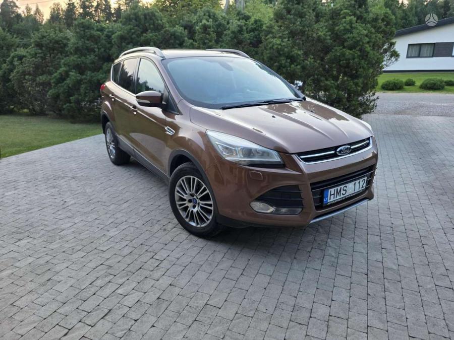 Brown Ford Kuga 2014 in Utena, with an engine capacity of 2.00 L and mileage of 238 thousand km for 4900 €, photo 4 on AUTOMOTO.COM.LV