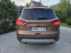 Brown Ford Kuga 2014 in Utena, with an engine capacity of 2.00 L and mileage of 238 thousand km for 4900 €, photo 6 on AUTOMOTO.COM.LV