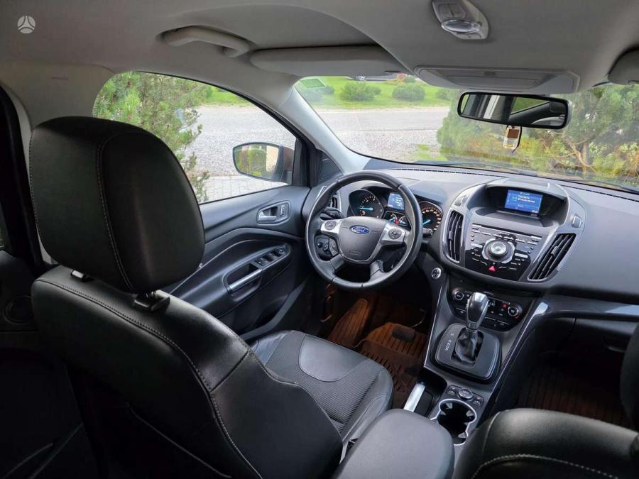 Brown Ford Kuga 2014 in Utena, with an engine capacity of 2.00 L and mileage of 238 thousand km for 4900 €, photo 12 on AUTOMOTO.COM.LV