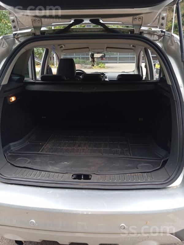 Grey Ford Kuga 2011 in Ogre, with an engine capacity of 2.00 L and mileage of 270 thousand km for 4700 €, photo 8 on AUTOMOTO.COM.LV