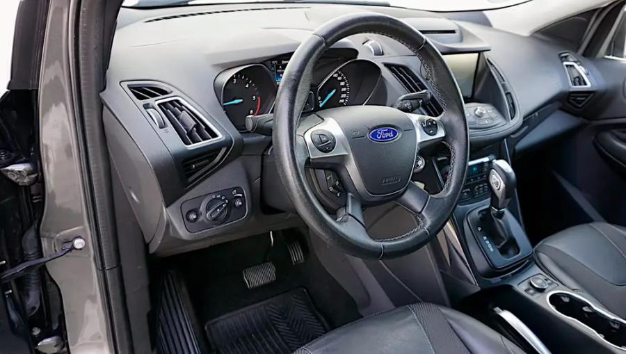 Grey Ford Kuga 2016 in Riga, with an engine capacity of 2.00 L and mileage of 267 thousand km for 10700 €, photo 21 on AUTOMOTO.COM.LV