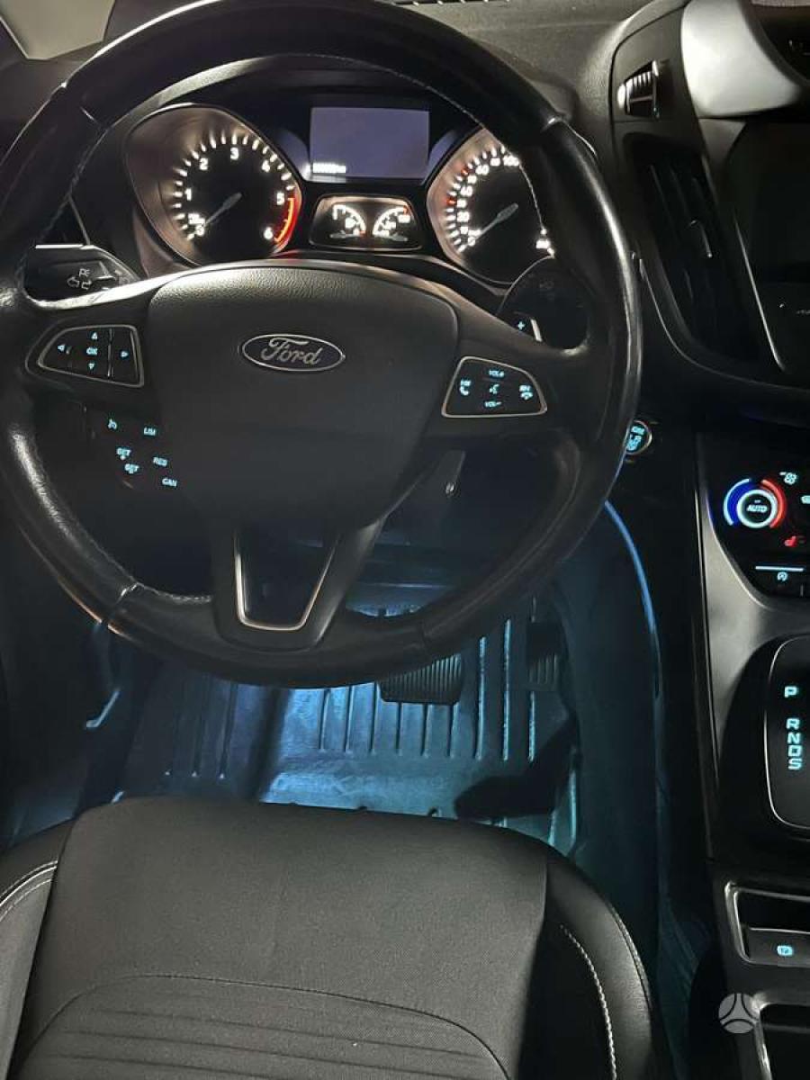 Grey Ford Kuga 2017 in Marijampole, with an engine capacity of 2.00 L and mileage of 231 thousand km for 8450 €, photo 23 on AUTOMOTO.COM.LV