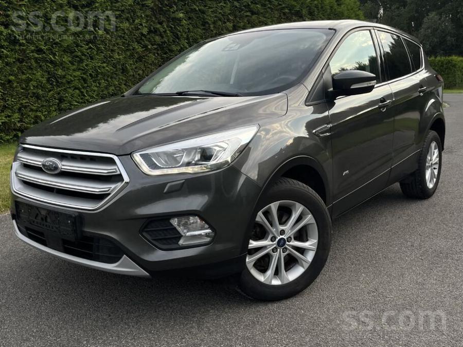 Grey Ford Kuga 2018 in Riga, with an engine capacity of 2.00 L and mileage of 200 thousand km for 9950 €, photo 1 on AUTOMOTO.COM.LV