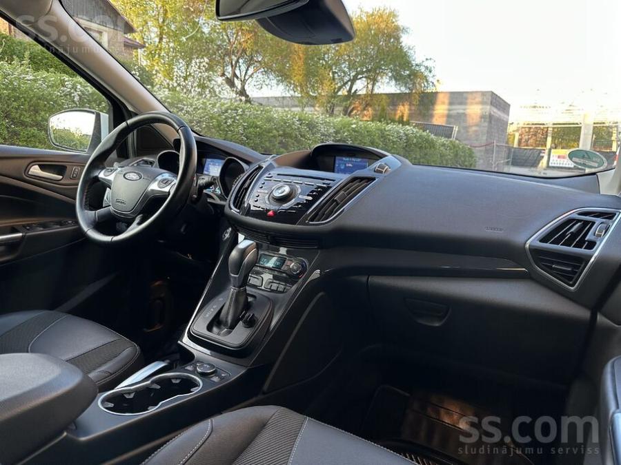 White Ford Kuga 2014 in Tukums, with an engine capacity of 2.00 L and mileage of 151 thousand km for 8990 €, photo 13 on AUTOMOTO.COM.LV