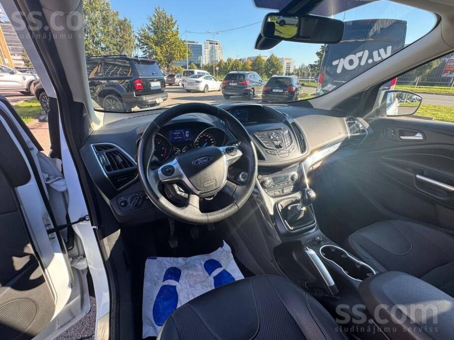White Ford Kuga 2014 in Riga, with an engine capacity of 2.00 L and mileage of 206 thousand km for 7990 €, photo 7 on AUTOMOTO.COM.LV