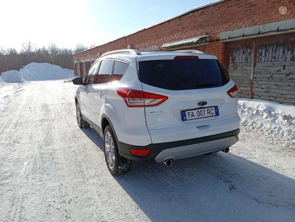 White Ford Kuga 2015 in Siauliai, with an engine capacity of 2.00 L and mileage of 240 thousand km for 7750 €, photo 2 on AUTOMOTO.COM.LV