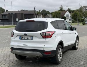 White Ford Kuga 2017 in Raseiniai, with an engine capacity of 2.00 L and mileage of 300 thousand km for 6499 €, photo 10 on AUTOMOTO.COM.LV