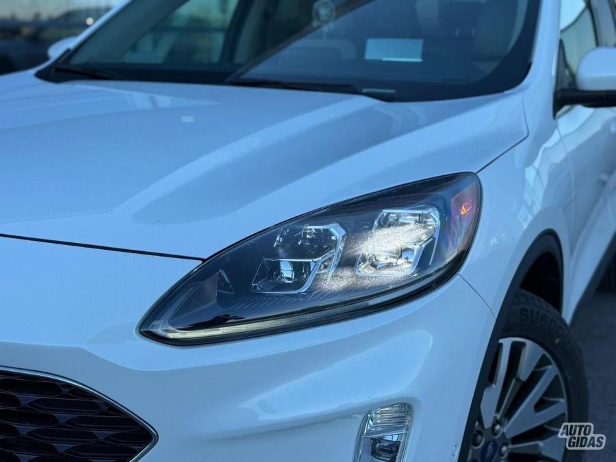 White Ford Kuga 2020 in Panevezys, with an engine capacity of 2.50 L and mileage of 53 thousand km for 20700 €, photo 26 on AUTOMOTO.COM.LV