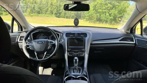 Black Ford Mondeo 2016 in Cesis, with an engine capacity of 2.00 L and mileage of 241 thousand km for 7699 €, photo 6 on AUTOMOTO.COM.LV