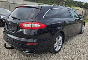 Black Ford Mondeo 2015 in Kaunas, with an engine capacity of 2.00 L and mileage of 262 thousand km for 6999 €, photo 8 on AUTOMOTO.COM.LV