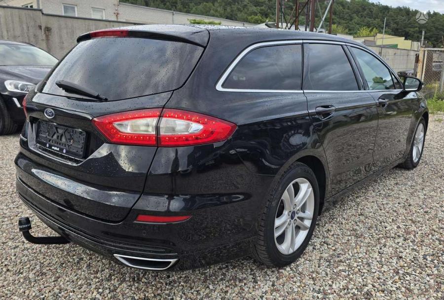 Black Ford Mondeo 2015 in Kaunas, with an engine capacity of 2.00 L and mileage of 262 thousand km for 6999 €, photo 8 on AUTOMOTO.COM.LV