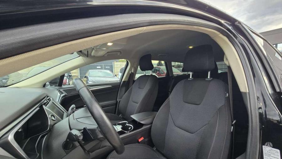 Black Ford Mondeo 2015 in Kaunas, with an engine capacity of 2.00 L and mileage of 262 thousand km for 6999 €, photo 11 on AUTOMOTO.COM.LV