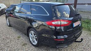Black Ford Mondeo 2015 in Kaunas, with an engine capacity of 2.00 L and mileage of 262 thousand km for 6999 €, photo 6 on AUTOMOTO.COM.LV