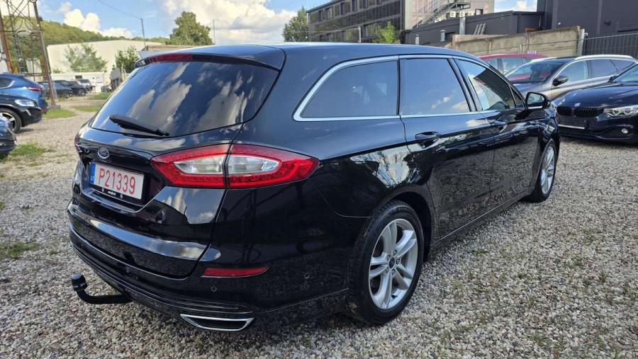 Black Ford Mondeo 2015 in Kaunas, with an engine capacity of 2.00 L and mileage of 262 thousand km for 6999 €, photo 8 on AUTOMOTO.COM.LV