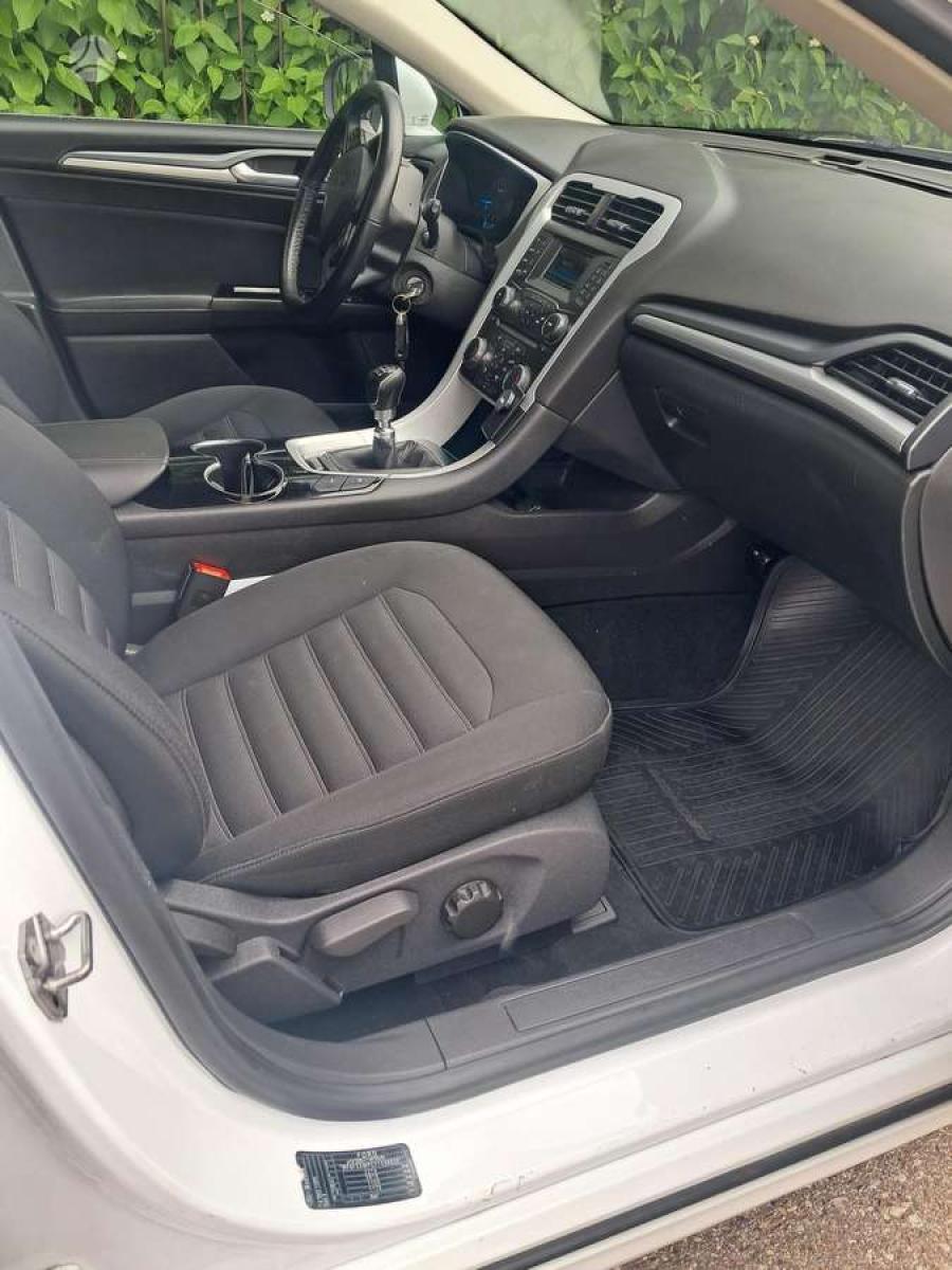 White Ford Mondeo 2015 in Kaunas, with an engine capacity of 1.56 L and mileage of 227 thousand km for 4990 €, photo 27 on AUTOMOTO.COM.LV