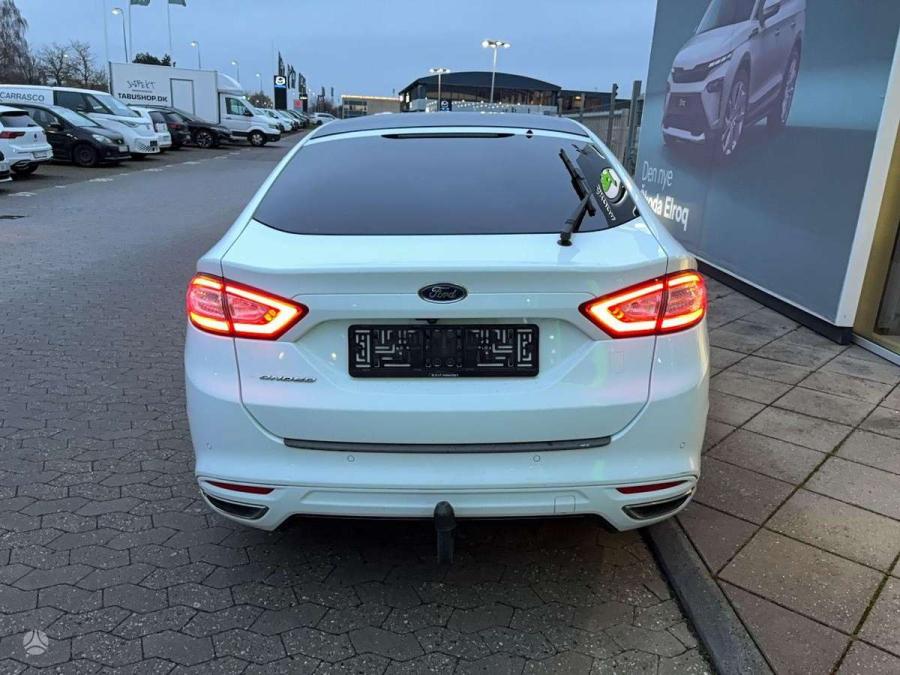 White Ford Mondeo 2016 in Kaunas, with an engine capacity of 2.00 L and mileage of 228 thousand km for 9950 €, photo 5 on AUTOMOTO.COM.LV