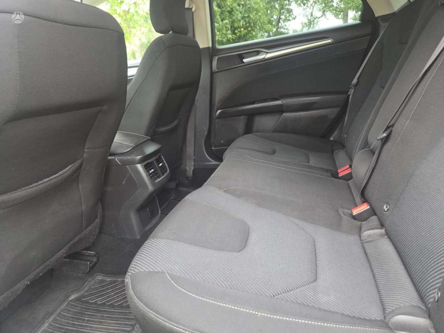 White Ford Mondeo 2016 in Alytus, with an engine capacity of 2.00 L and mileage of 247 thousand km for 5249 €, photo 9 on AUTOMOTO.COM.LV