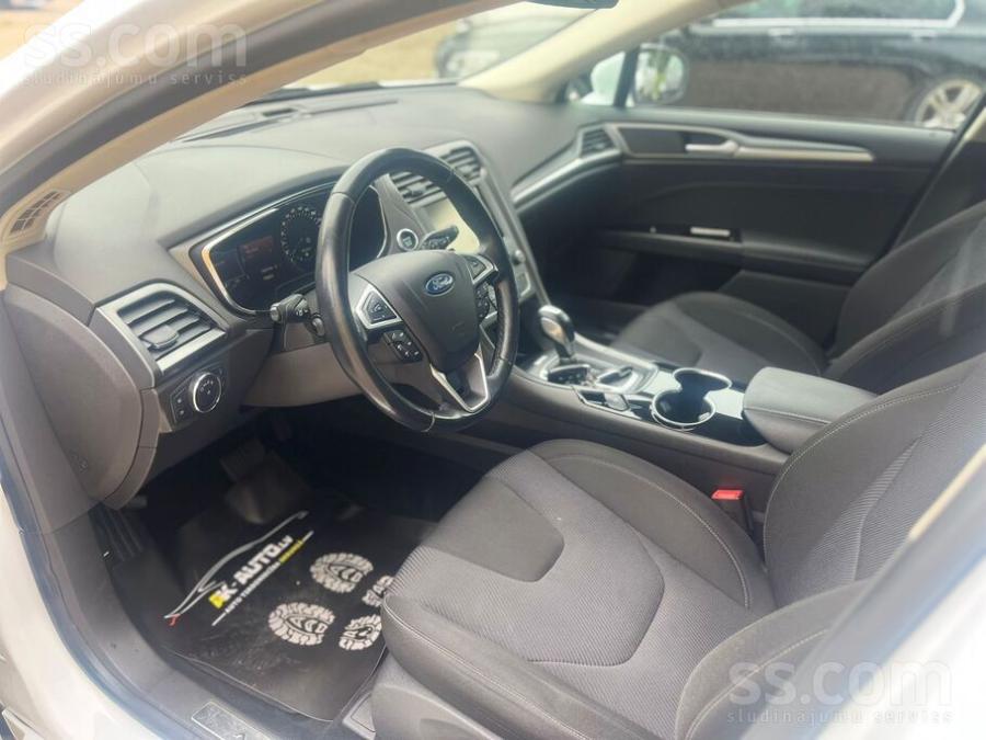 White Ford Mondeo 2014 in Kuldiga, with an engine capacity of 2.00 L and mileage of 299 thousand km for 6390 €, photo 7 on AUTOMOTO.COM.LV