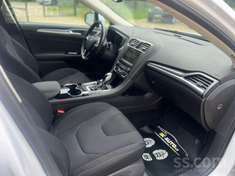 White Ford Mondeo 2014 in Kuldiga, with an engine capacity of 2.00 L and mileage of 299 thousand km for 6390 €, photo 13 on AUTOMOTO.COM.LV