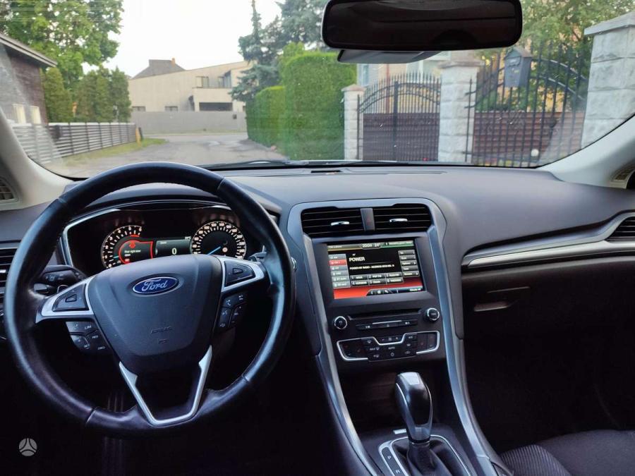 White Ford Mondeo 2015 in Marijampole, with an engine capacity of 2.00 L and mileage of 261 thousand km for 6800 €, photo 14 on AUTOMOTO.COM.LV