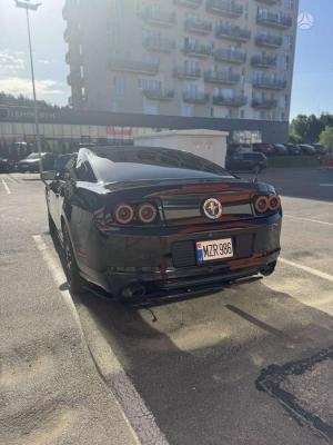 Black Ford Mustang 2014 in Vilnius, with an engine capacity of 3.73 L and mileage of 207 thousand km for 14999 €, photo 8 on AUTOMOTO.COM.LV