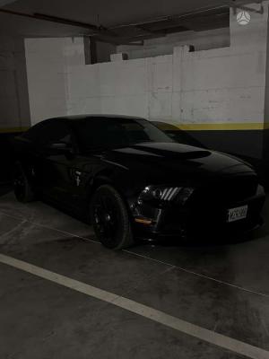 Black Ford Mustang 2014 in Vilnius, with an engine capacity of 3.73 L and mileage of 207 thousand km for 14999 €, photo 18 on AUTOMOTO.COM.LV