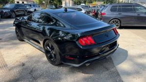 Black Ford Mustang 2021 in Ukmerge, with an engine capacity of 2.25 L and mileage of 67 thousand km for 8999 €, photo  on AUTOMOTO.COM.LV