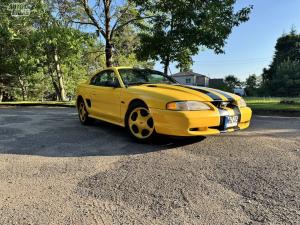 Dzeltens Ford Mustang 1998 Kelmė, ar dzinēja tilpumu 4.60 L un nobraukumu 153 tūkst. km par 6600 €, foto  vietnē AUTOMOTO.COM.LV