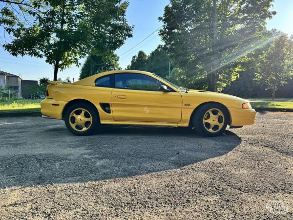 Yellow Ford Mustang 1998 in Kelme, with an engine capacity of 4.60 L and mileage of 153 thousand km for 6600 €, photo 2 on AUTOMOTO.COM.LV