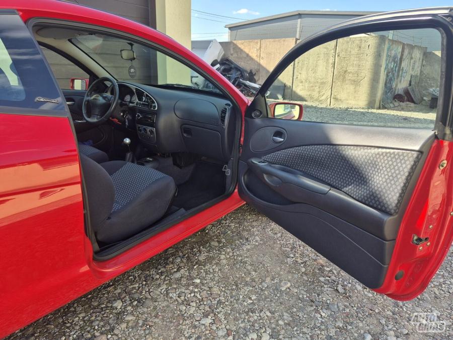 Red Ford Puma 1998 in Klaipeda, with an engine capacity of 1.40 L and mileage of 37 thousand km for 3999 €, photo 14 on AUTOMOTO.COM.LV