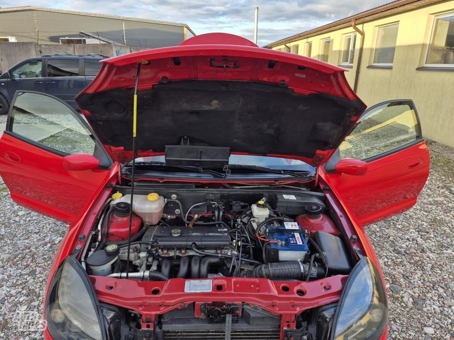 Red Ford Puma 1998 in Klaipeda, with an engine capacity of 1.40 L and mileage of 37 thousand km for 3999 €, photo 20 on AUTOMOTO.COM.LV