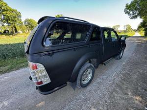 Black Ford Ranger 2009 in Panevezys, with an engine capacity of 2.50 L and mileage of 247 thousand km for 4999 €, photo 6 on AUTOMOTO.COM.LV