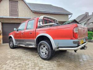 Red Ford Ranger 2006 in Telschi, with an engine capacity of 2.50 L and mileage of 129 thousand km for 3650 €, photo 5 on AUTOMOTO.COM.LV