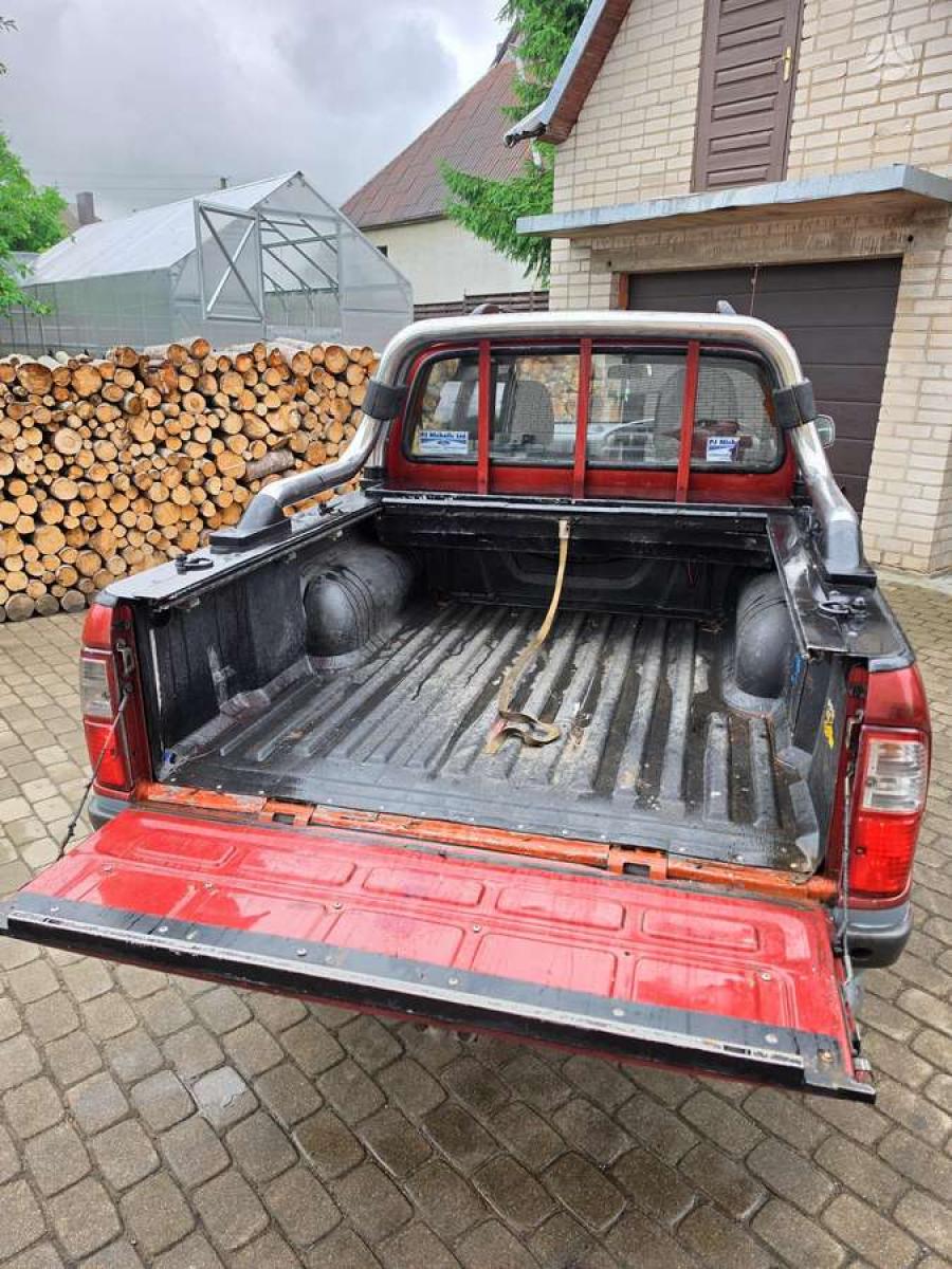 Red Ford Ranger 2006 in Telschi, with an engine capacity of 2.50 L and mileage of 129 thousand km for 3650 €, photo 8 on AUTOMOTO.COM.LV