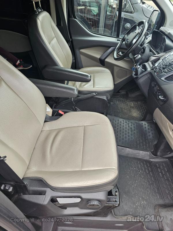 Black Ford Tourneo 2016 in Tallinn, with an engine capacity of 2.00 L and mileage of 154 thousand km for 24000 €, photo 6 on AUTOMOTO.COM.LV
