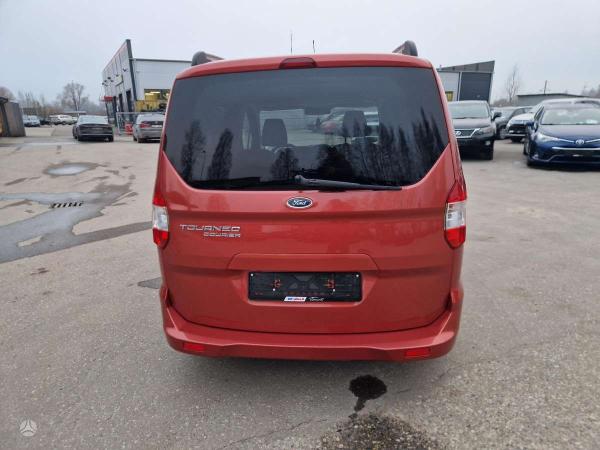 Orange Ford tourneo-courier 2014 in Ukmerge, with an engine capacity of 1.50 L and mileage of 220 thousand km for 5250 €, photo 7 on AUTOMOTO.COM.LV
