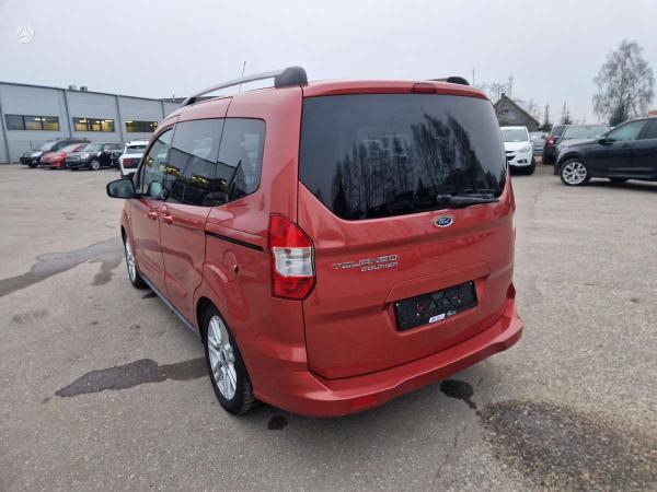 Orange Ford tourneo-courier 2014 in Ukmerge, with an engine capacity of 1.50 L and mileage of 220 thousand km for 5250 €, photo 8 on AUTOMOTO.COM.LV