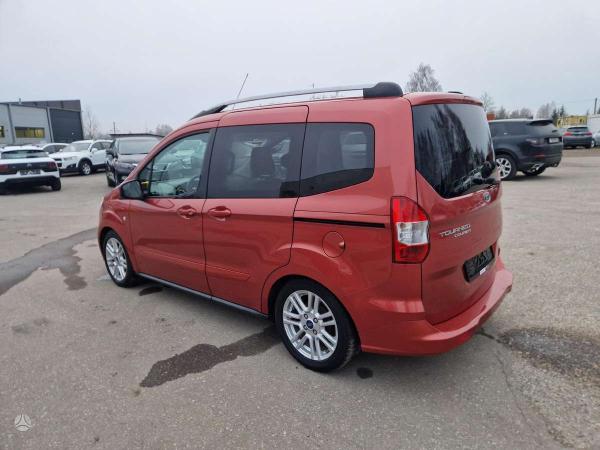 Orange Ford tourneo-courier 2014 in Ukmerge, with an engine capacity of 1.50 L and mileage of 220 thousand km for 5250 €, photo 9 on AUTOMOTO.COM.LV