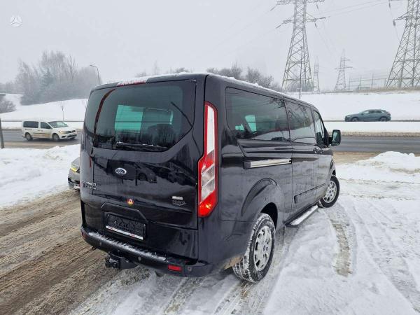 Black Ford Tourneo Custom 2013 in Kaunas, with an engine capacity of 2.20 L and mileage of 232 thousand km for 11500 €, photo 6 on AUTOMOTO.COM.LV
